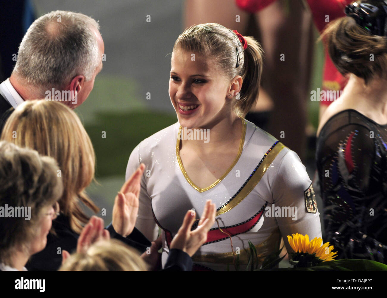German athlete Elisabeth Seitz (C) cheers during the award ceremony ...