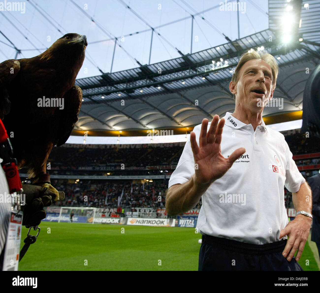 Frankfurt's head coach Christoph Daum smiles and gestures prior to the ...