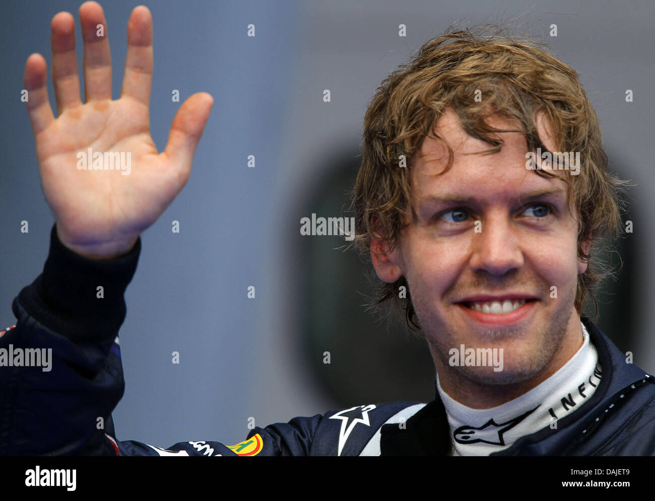 German Formula One driver Sebastian Vettel of Red Bull smiles and ...