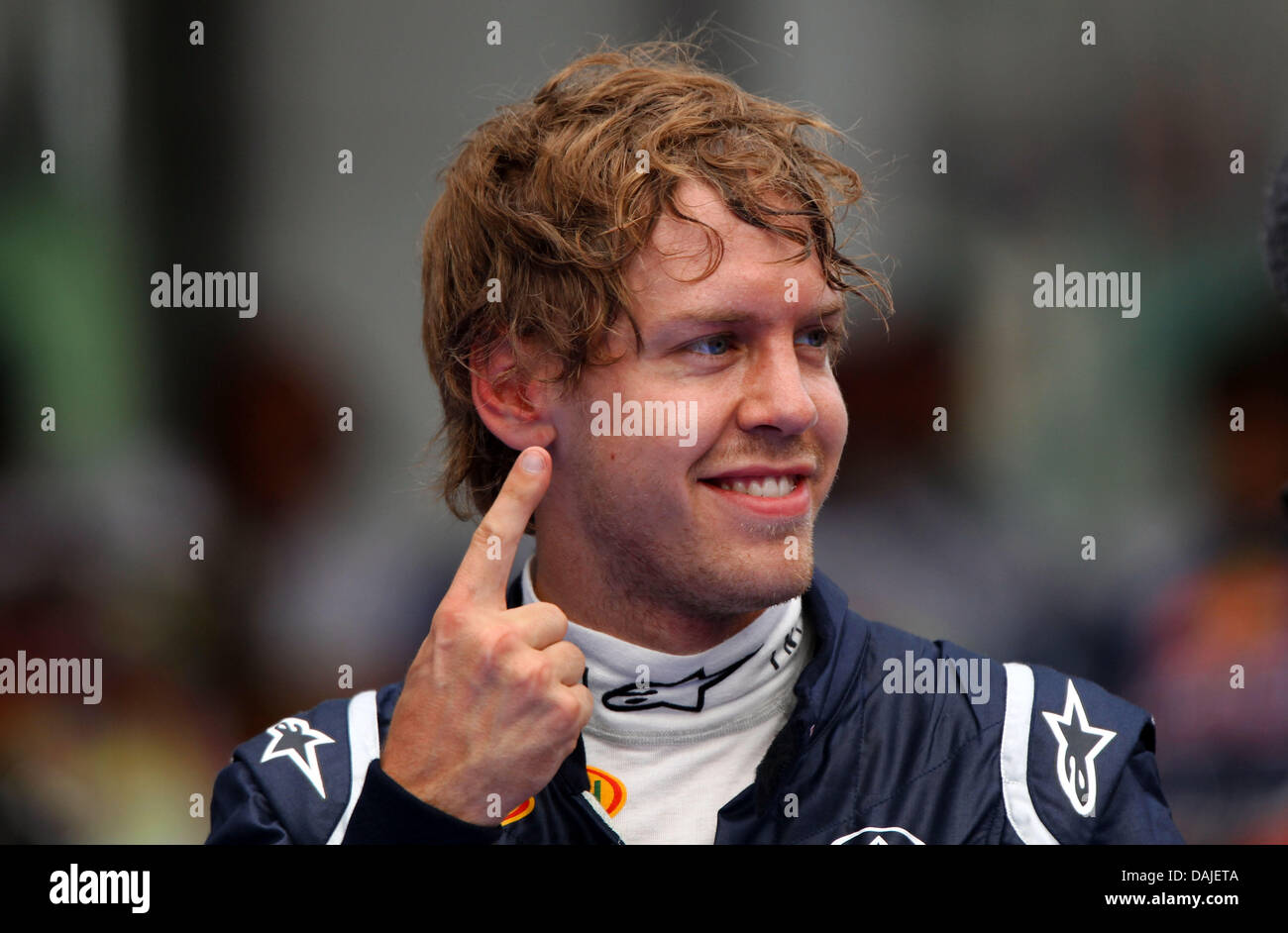 German Formula One driver Sebastian Vettel of Red Bull smiles and ...