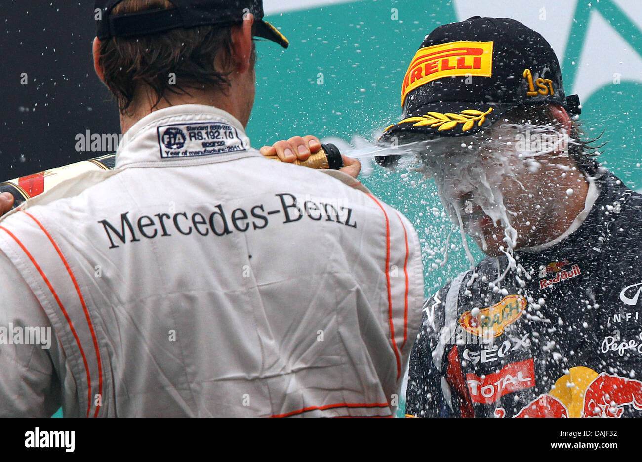 German Formula One driver Sebastian Vettel (R) of Red Bull Racing ...