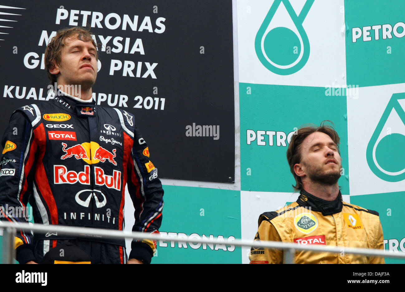 German Formula One driver Sebastian Vettel (L) of Red Bull Racing and ...