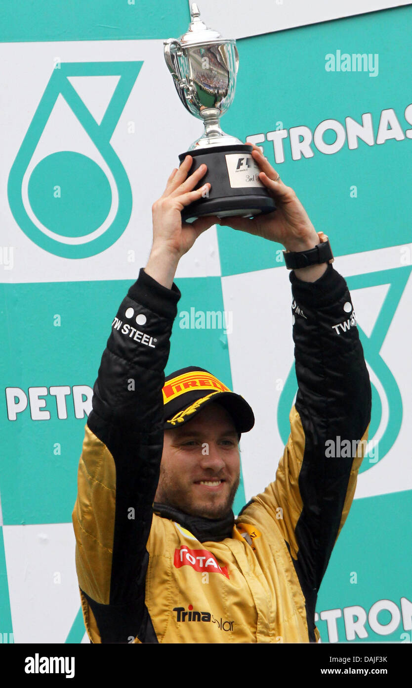 German Formula One driver Nick Heidfeld of Lotus Renault celebrates ...