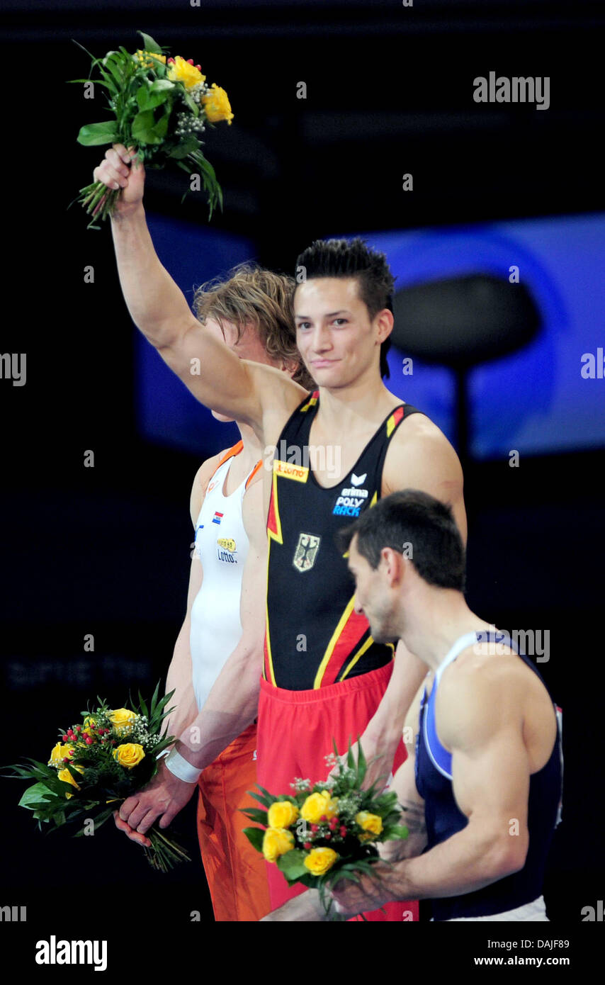 German gymnast Marcel Nguyen (C) celebrates winning the beam final of ...