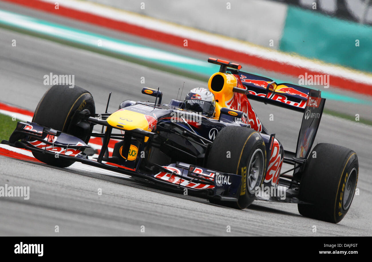 German Formula One driver Sebastian Vettel of Red Bull steers his car ...