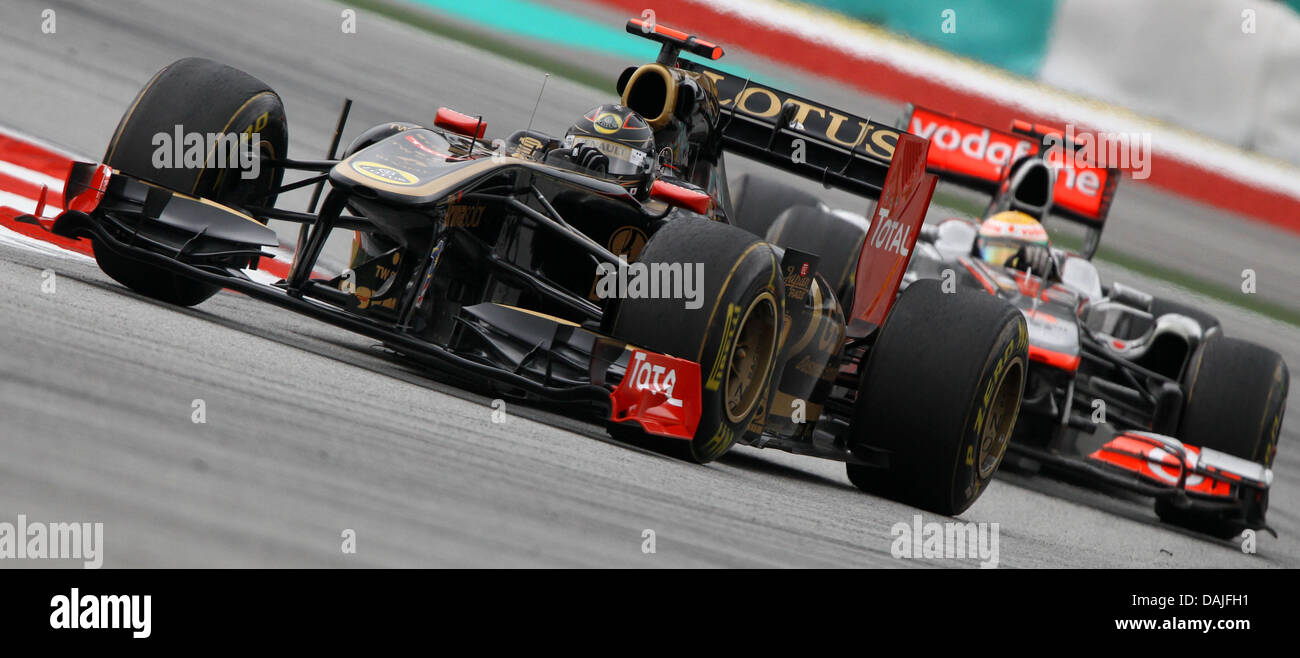 German Formula One driver Nick Heidfeld of Lotus Renault steers his car ...