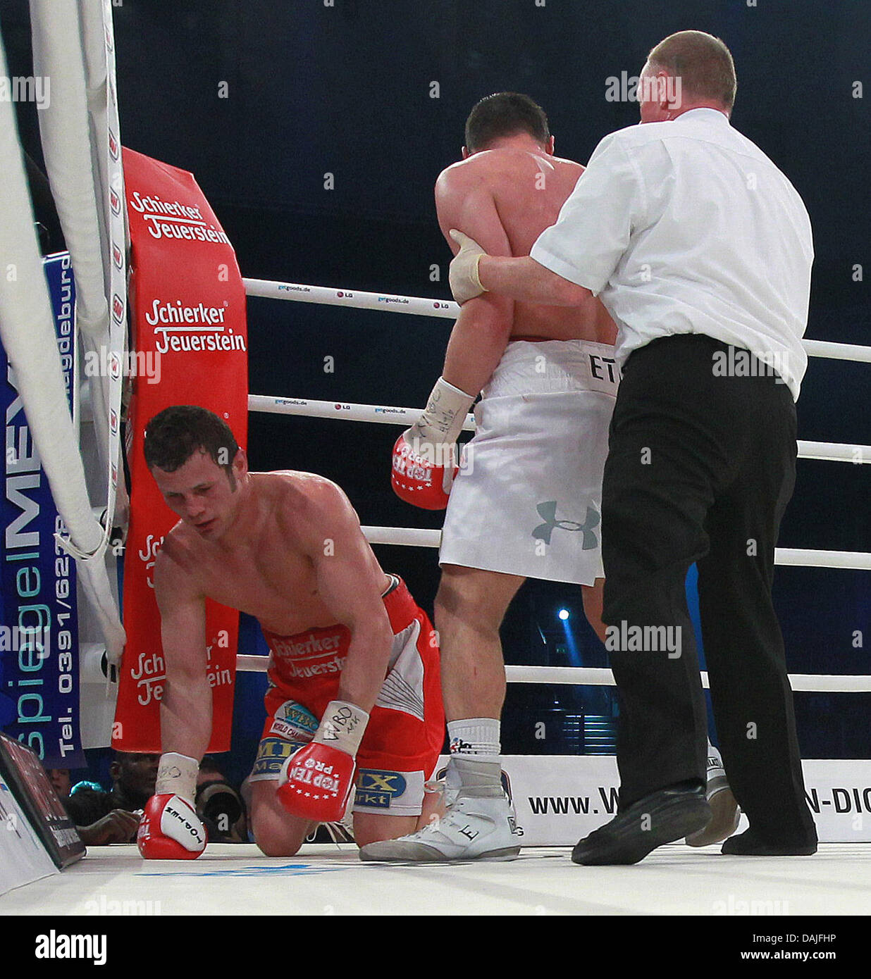 German boxer Robert Stieglitz (L) fights Armenia's Khoren Gevor (C) for ...