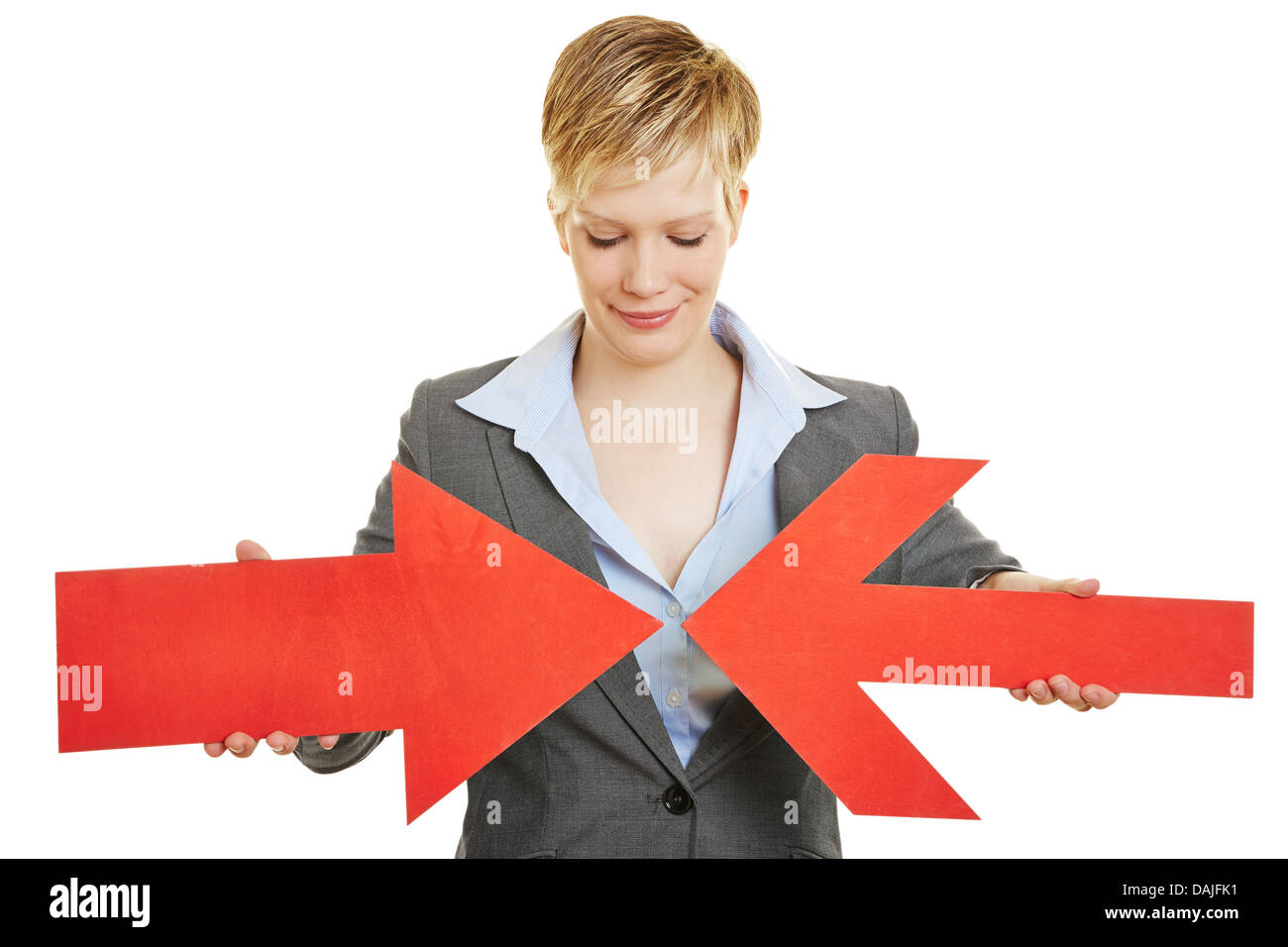 Business woman with two big red converging arrows Stock Photo - Alamy