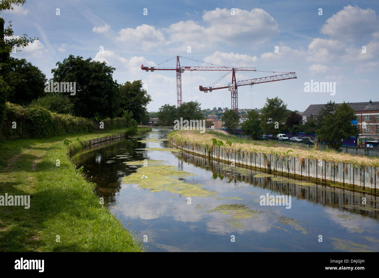 View of The New River in North London, N4 with building cranes in the ...