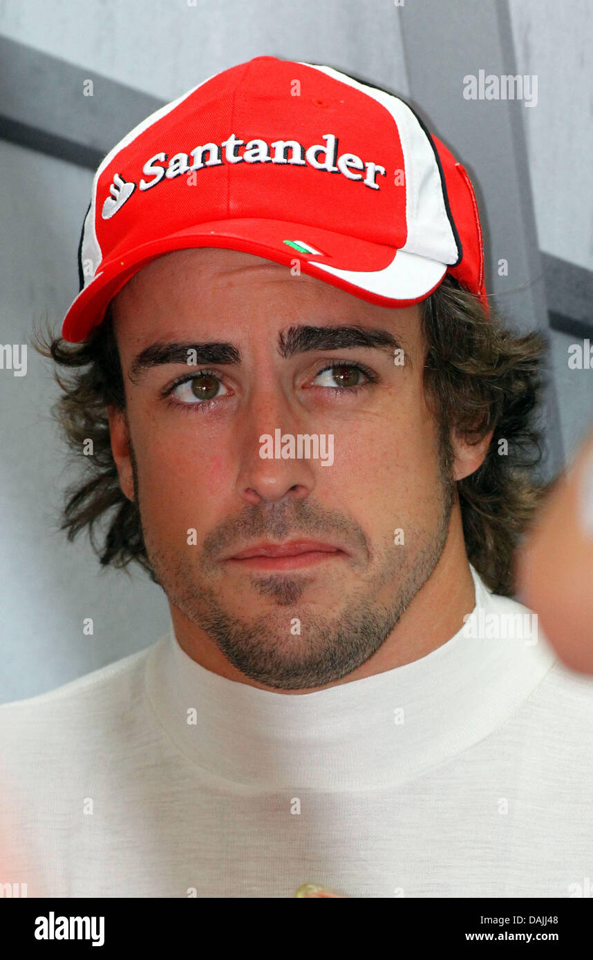 Spanish Formula One driver Fernando Alonso of Ferrari sits in the ...