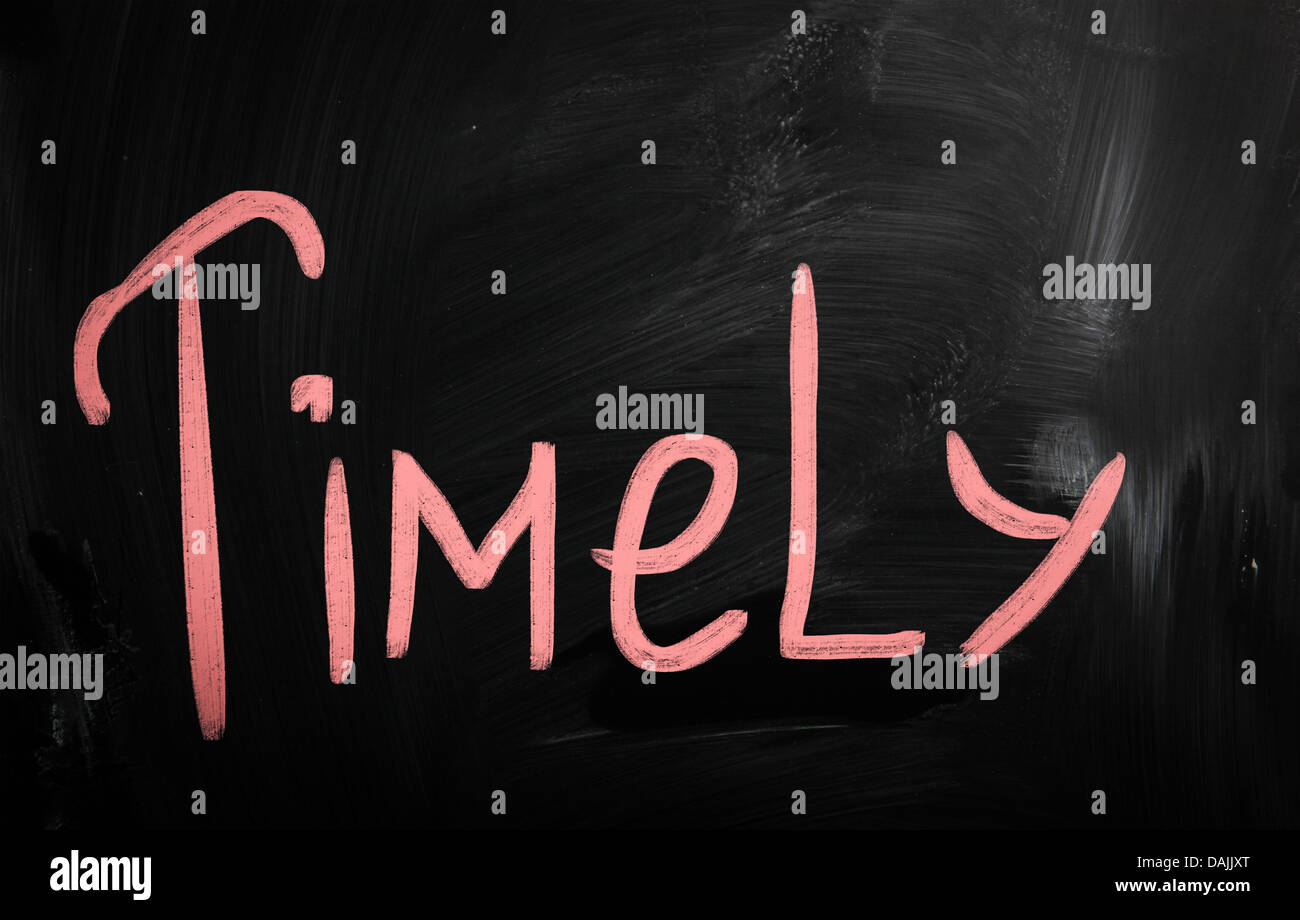 Timely handwritten with white chalk on a blackboard Stock Photo - Alamy