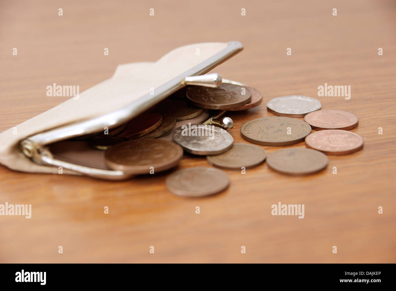 Purse filled with uk coins hi-res stock photography and images - Alamy
