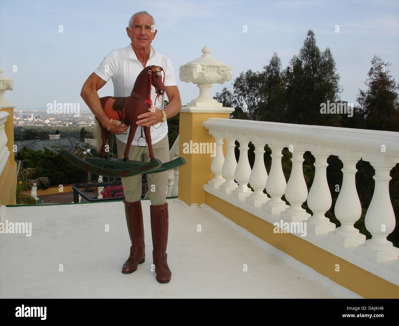 Frederic Prince of Anhalt poses next to a wooden doll and a horse on ...