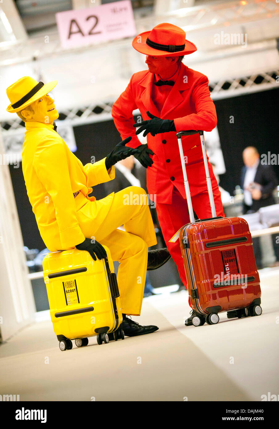 Two pantomimes perform a scene with suicases of manufacturer Scout at ...