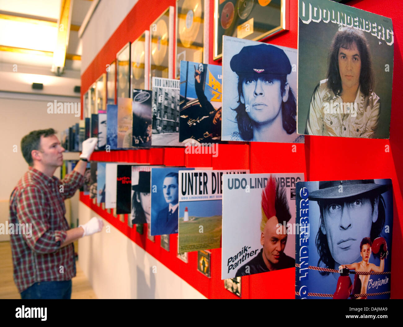 Exhibition designer John Moeller fixes vinyl record covers with singer ...