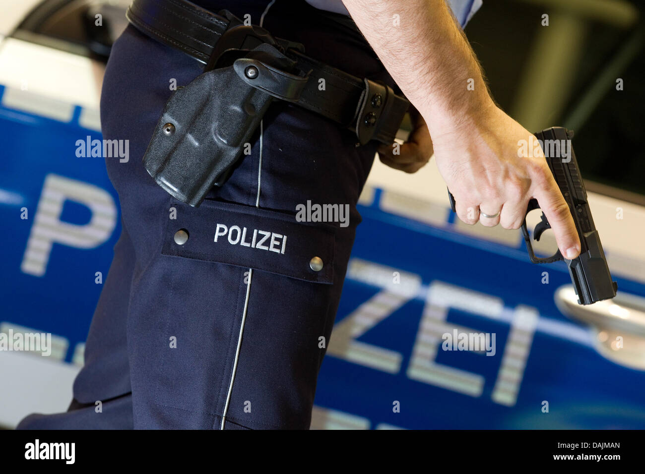Policeman with a gun hi-res stock photography and images - Alamy