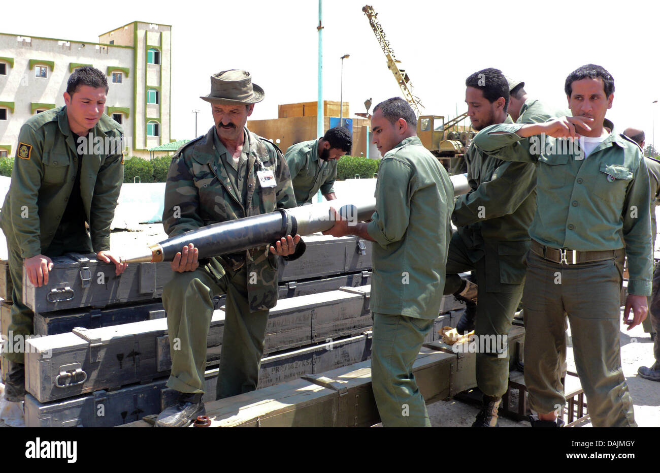 (TECHNICAL REPETITION) Libyan rebels ply with rockets, that were left ...