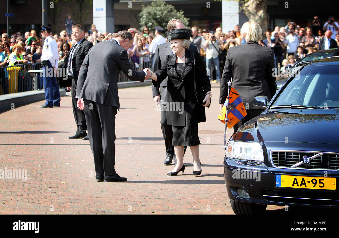 Queen Beatrix of The Netherlands is welcomed at the memorial service ...