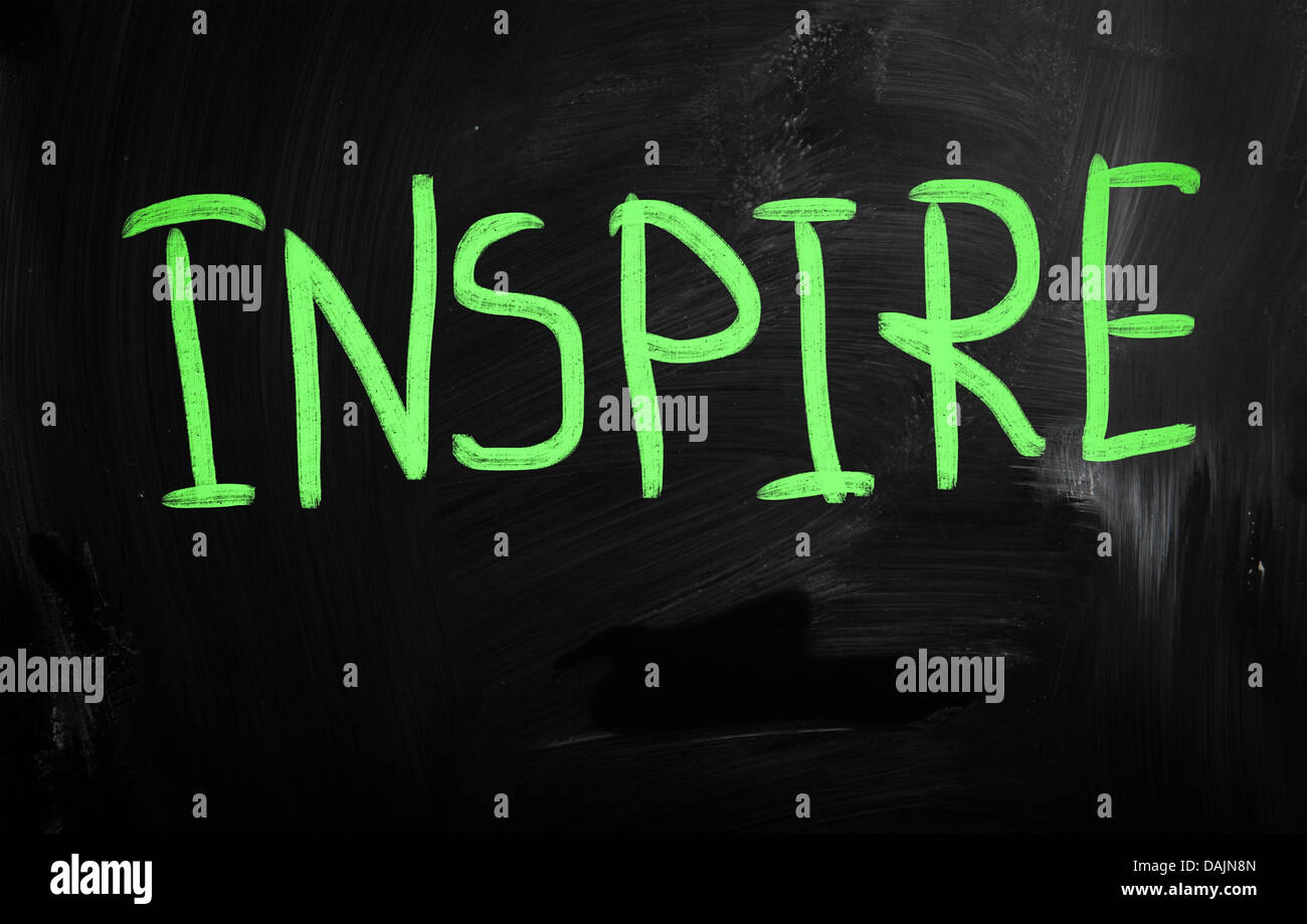 Inspire handwritten with white chalk on a blackboard Stock Photo - Alamy