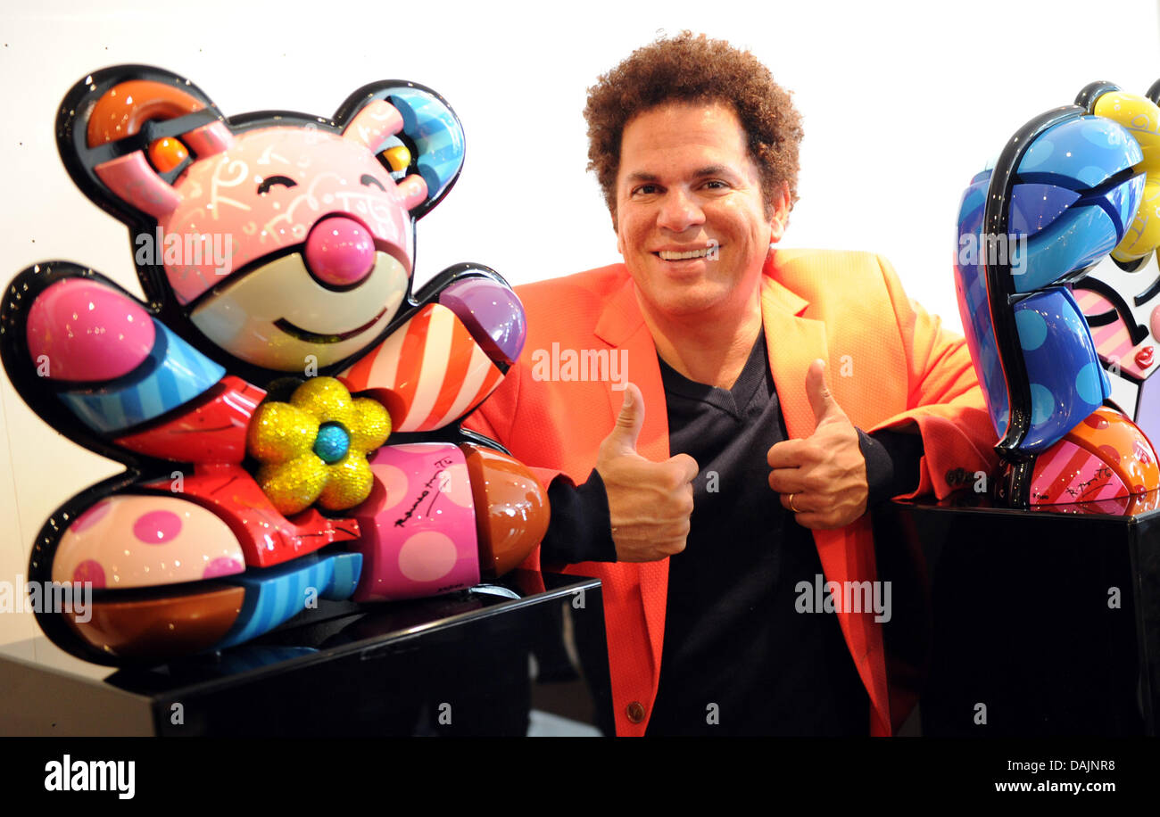 Brazilian pop-art artist Romero Britto gestures a thumbs-up as he ...