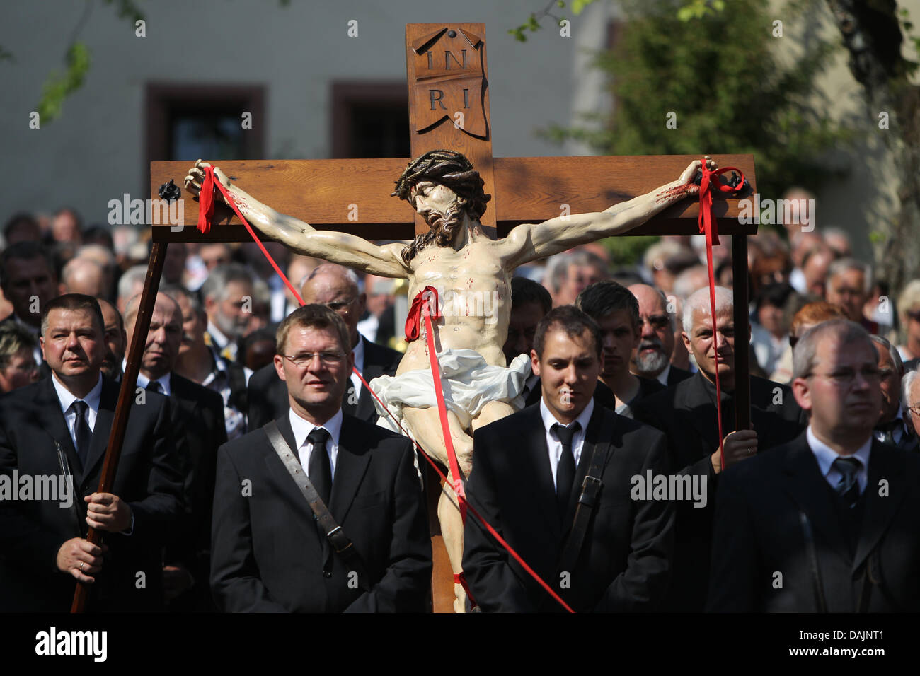 Members of different guilds carry lifesize Jesus figures for the Good ...