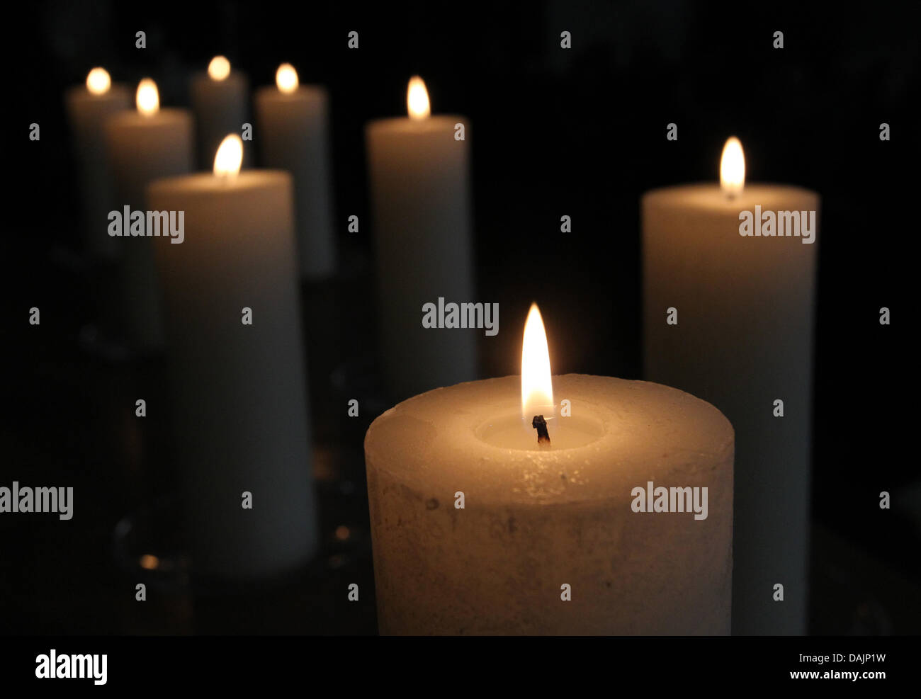 A candle burns for each of the eight dead in the multiple car collision ...