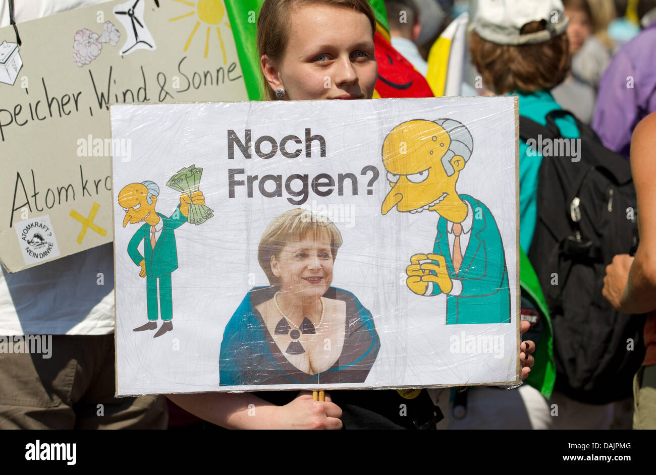 Anti-nuclear activists participate with banners in an easter protest ...