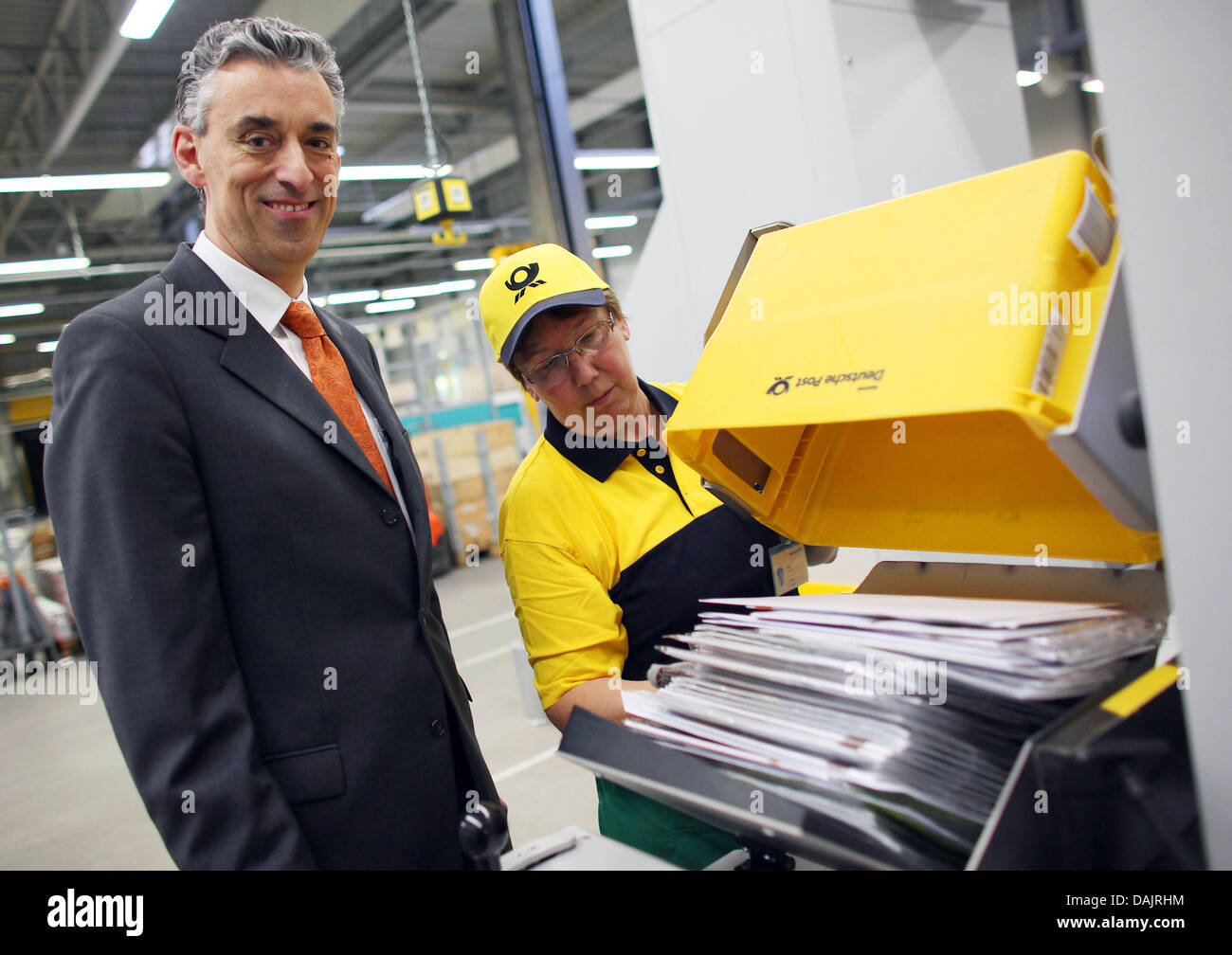 Deutsche Post and DHL CEO Frank Appel checks out the letter assorting ...
