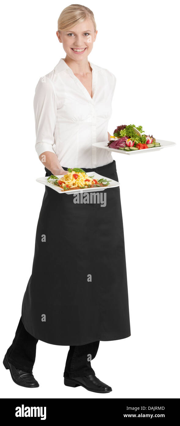 Portrait of a young woman with plates of food, smiling Stock Photo - Alamy