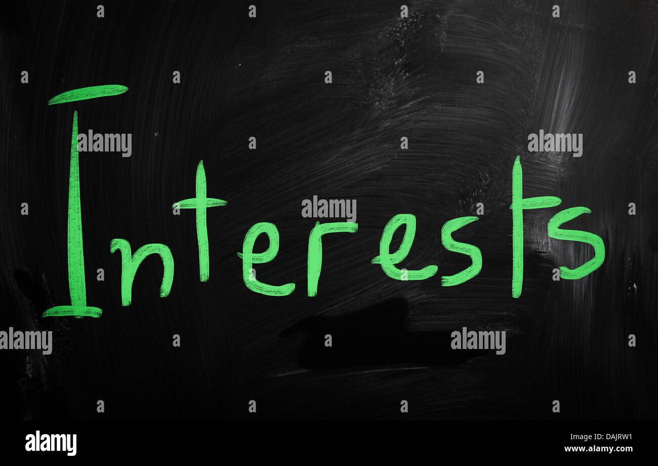Interests handwritten with white chalk on a blackboard Stock Photo - Alamy