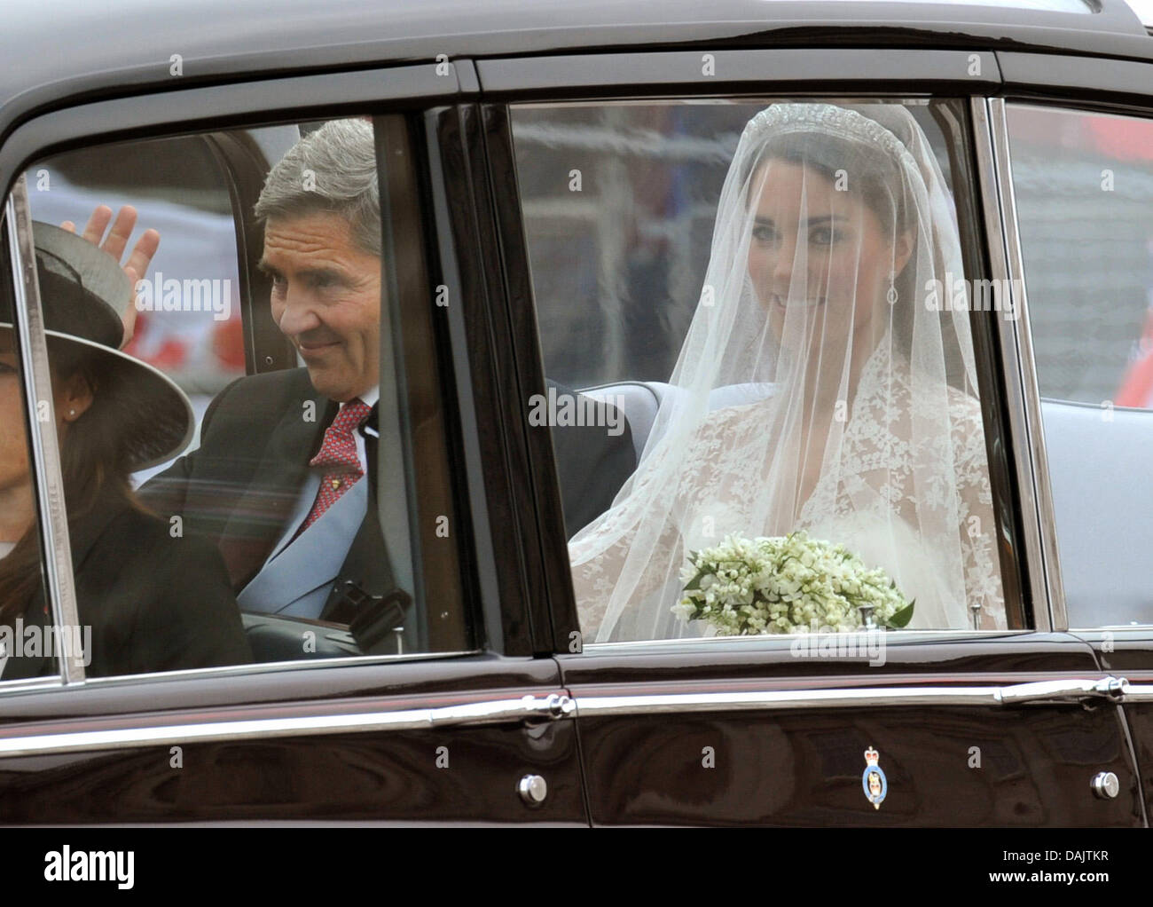 Kate Middleton (R) and her father Michael Middleton travel in a 1977 ...