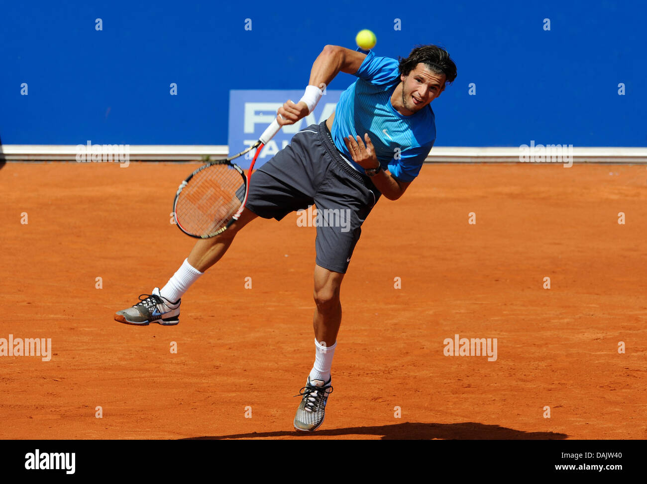 Bulgarian tennis professional Grigor Dimitrow hits the ball in his ...