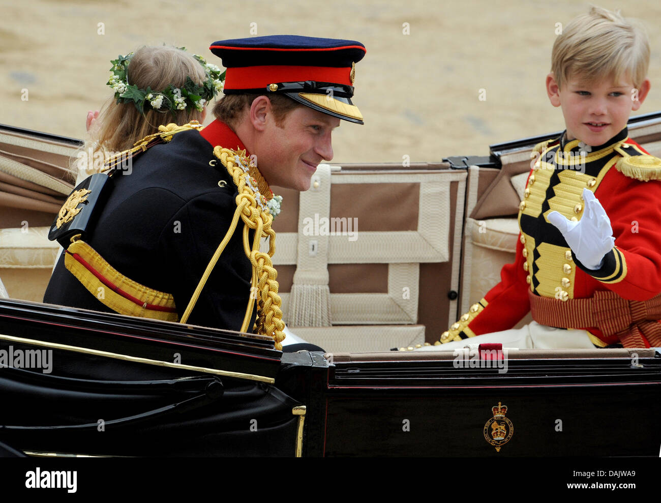 Prince Harry and page boy William Lowther-Pinkerton ride in a horse ...