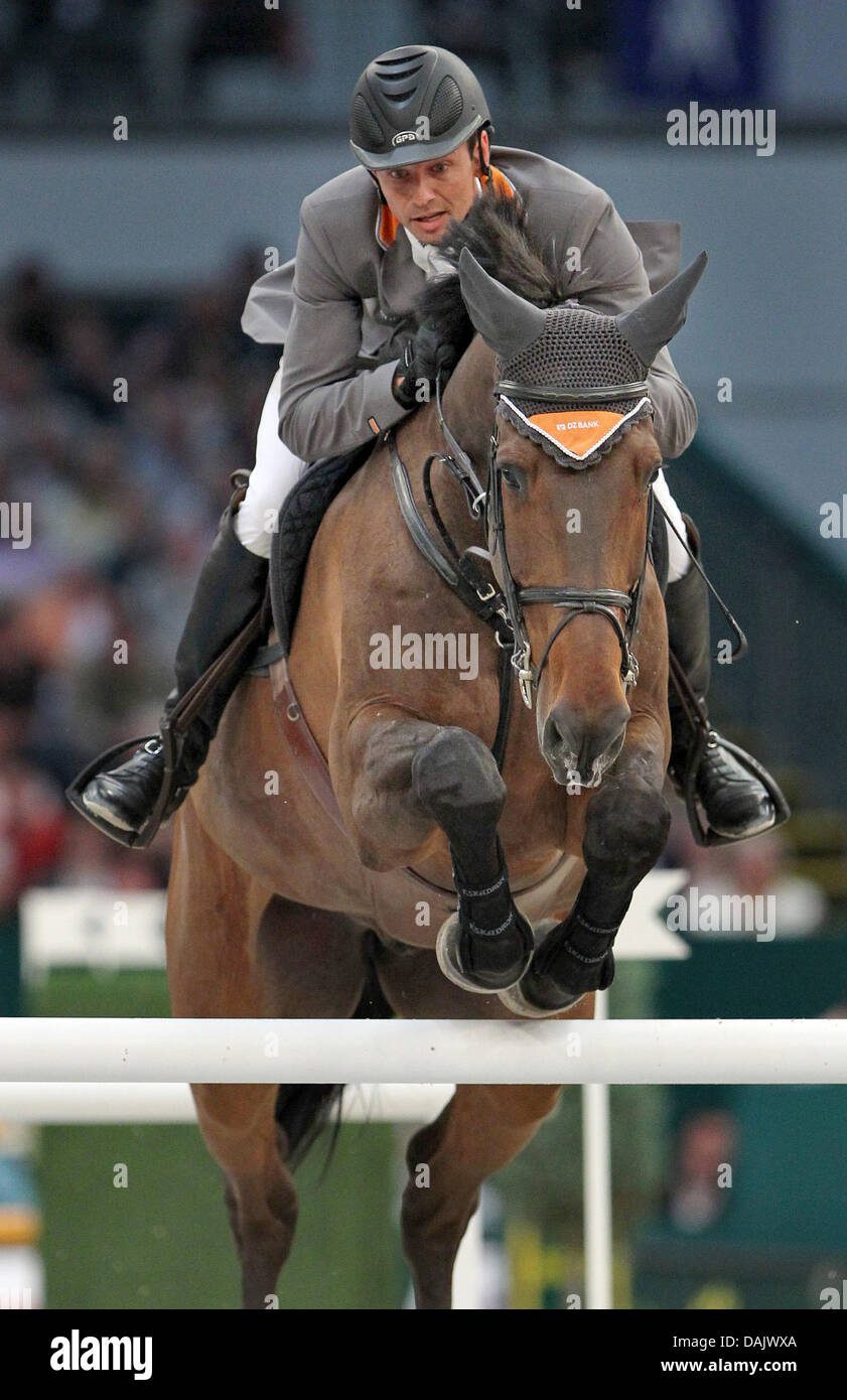 German rider Marco Kutscher jumps on Cash at the FEI World Cup jumping ...