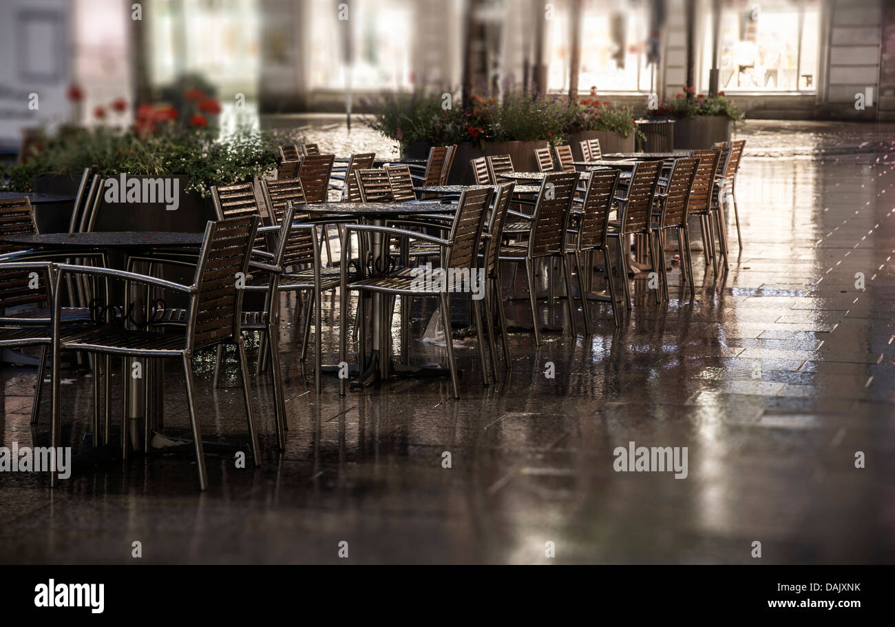 Wet restaurant chairs and restaurant tables, marketplace Stock Photo ...