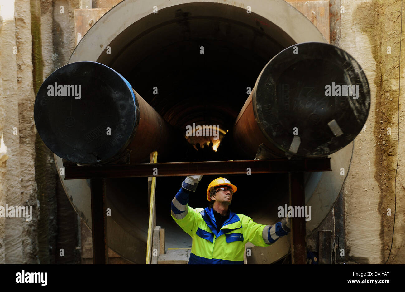 Vattenfall worker Dirk Grimm inspects two new teleheating tunnels in ...