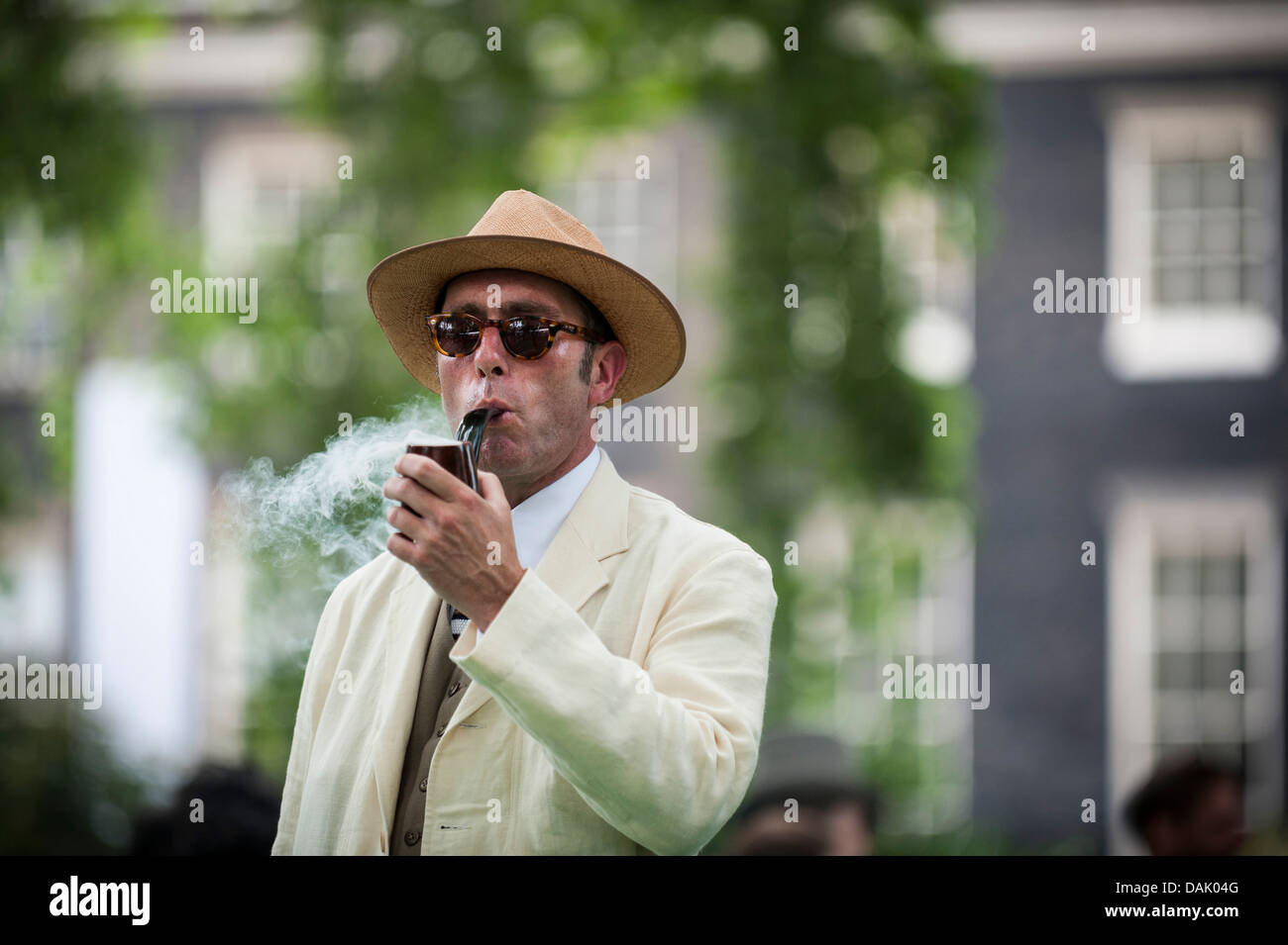 Gustav Temple, editor of the Chap magazine smoking the official pipe at ...
