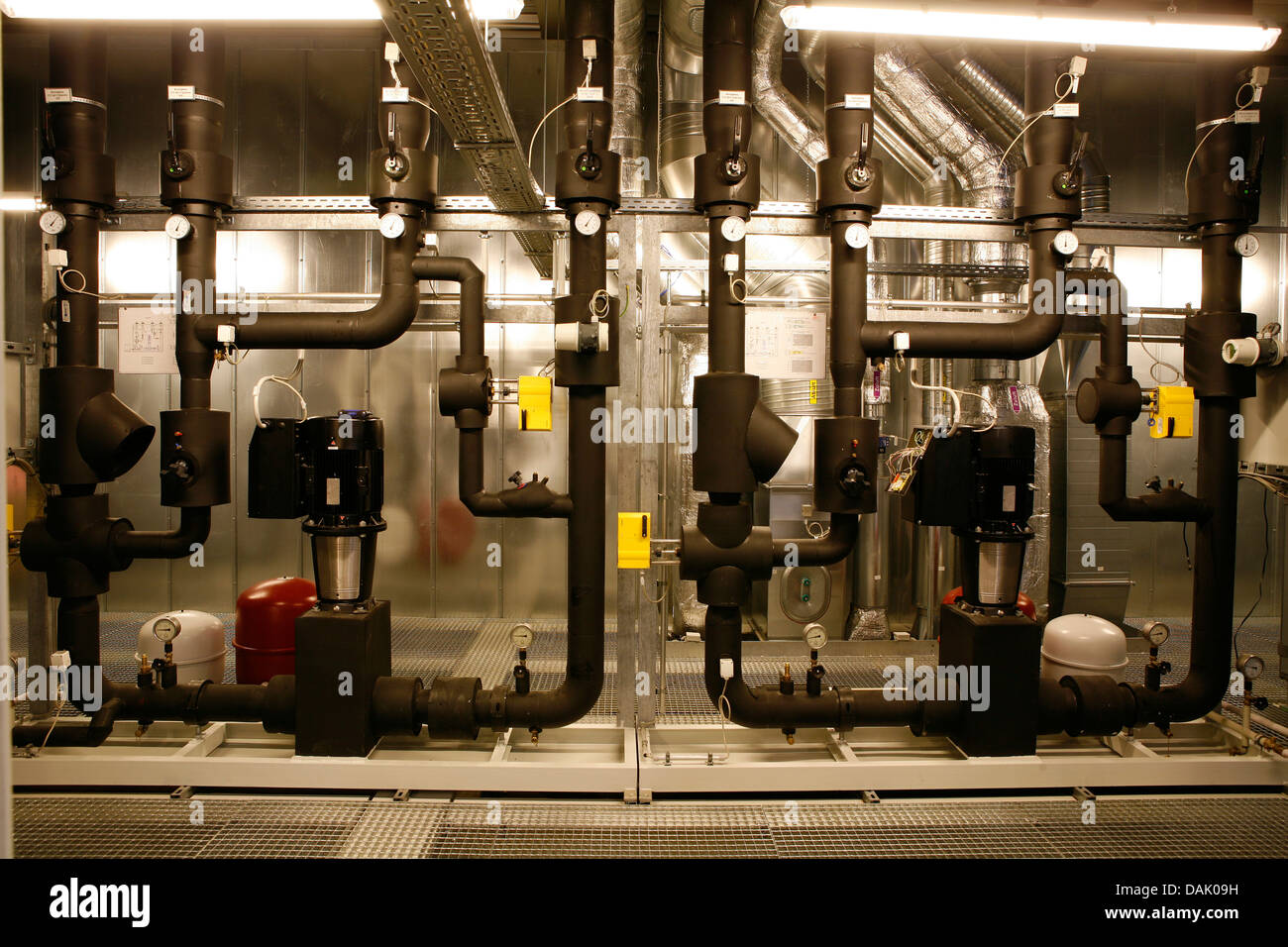 Large new industrial heating system, heating pipes Stock Photo - Alamy