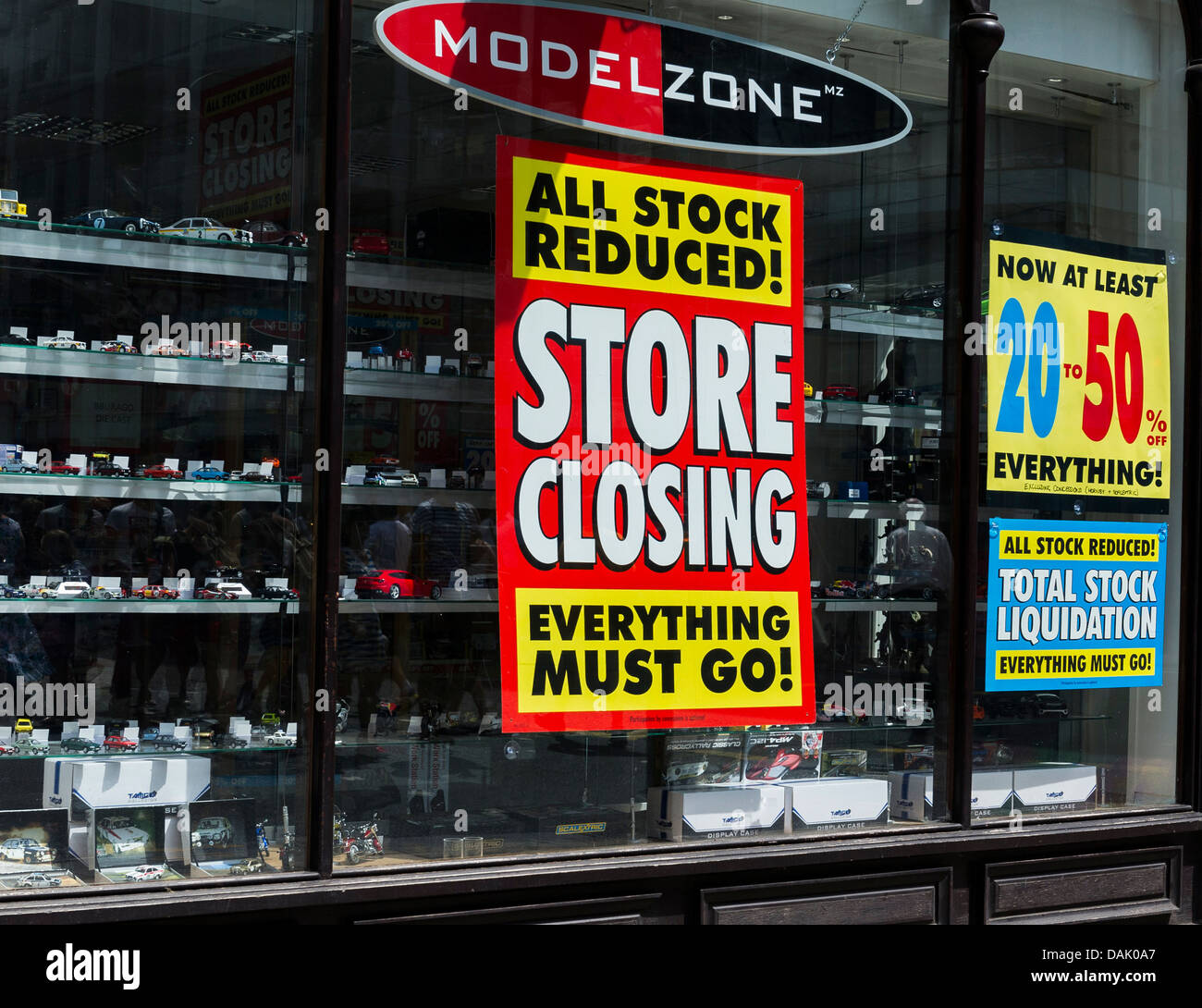 A sign in the window of a Modelzone shop announcing it's closure Stock ...