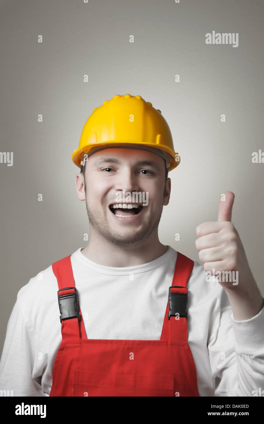 Smiling young worker Stock Photo - Alamy