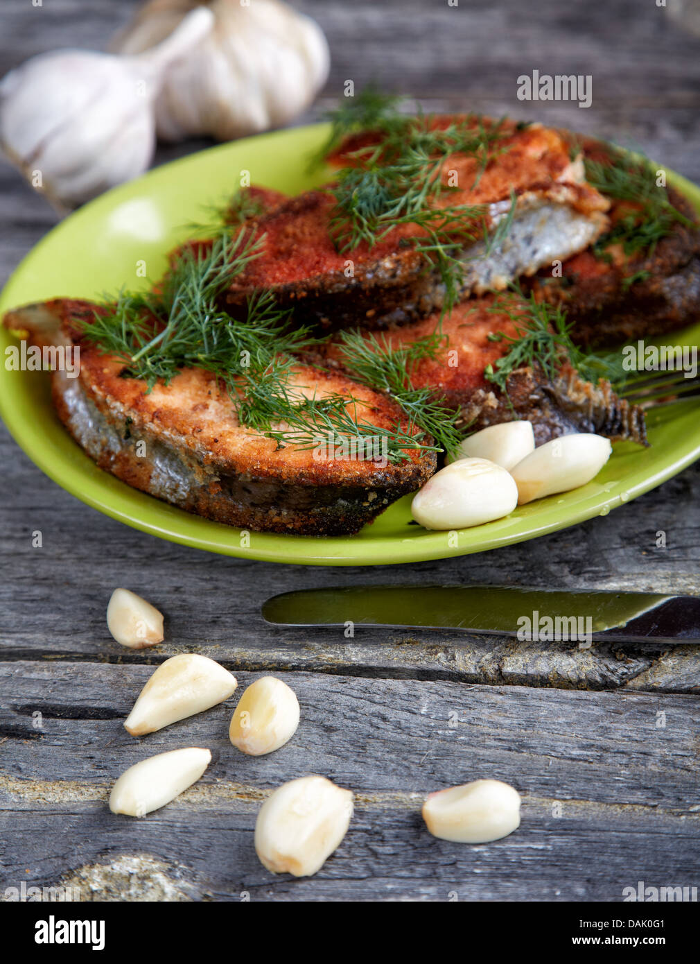 Fried fish with garlic hi-res stock photography and images - Alamy