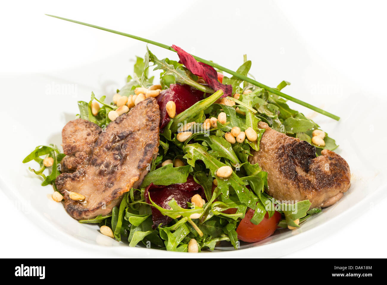 rabbit liver salad with arugula in a restaurant Stock Photo - Alamy