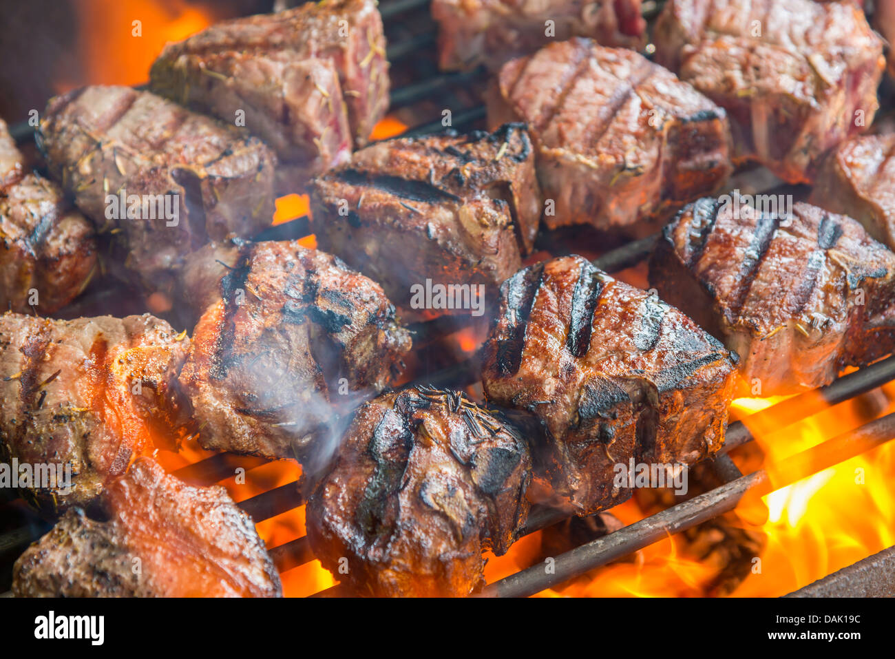 Grilling T bone steaks on barbecue, close up Stock Photo - Alamy
