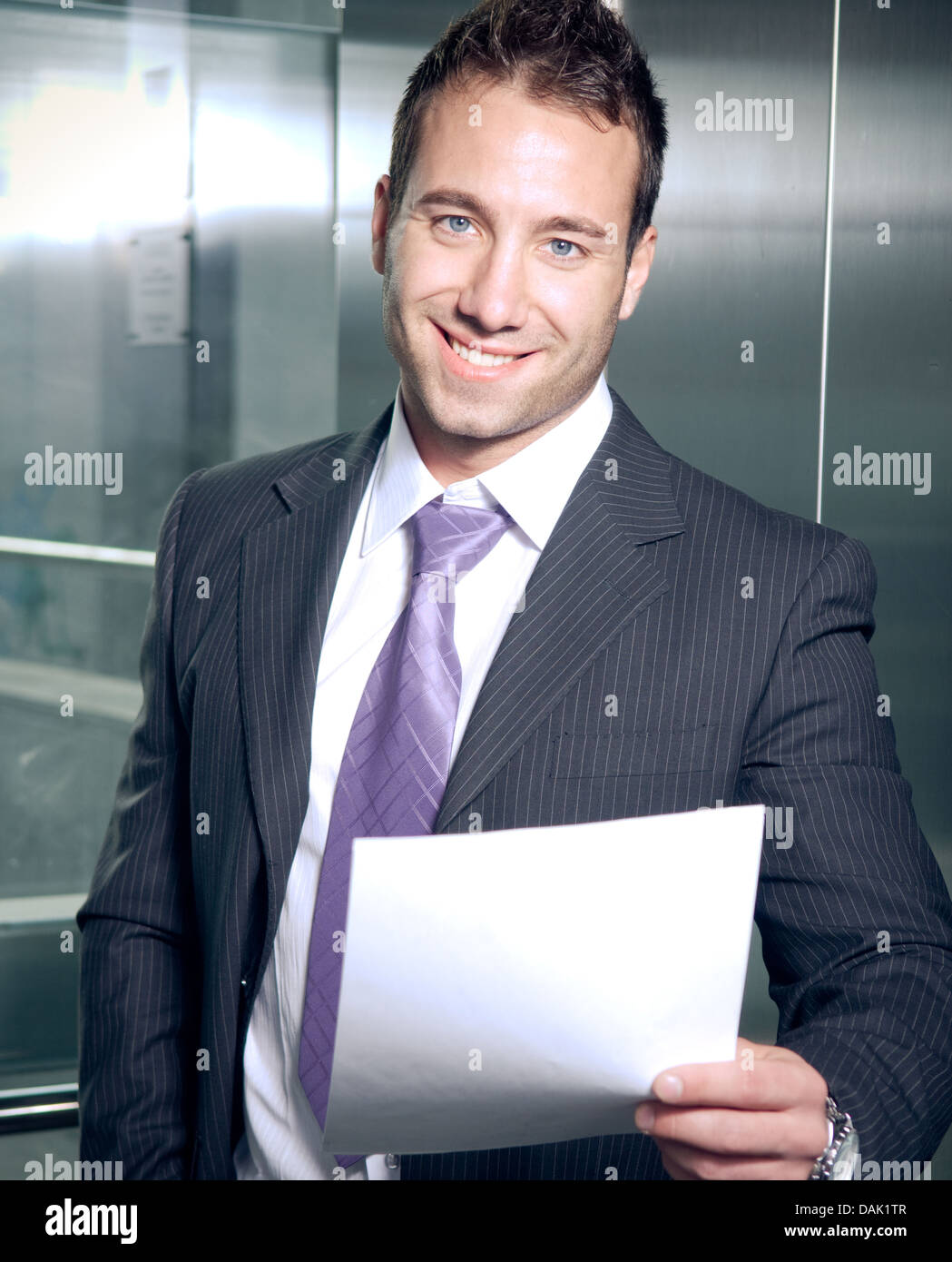 Young smiling businessman paper hi-res stock photography and images - Alamy