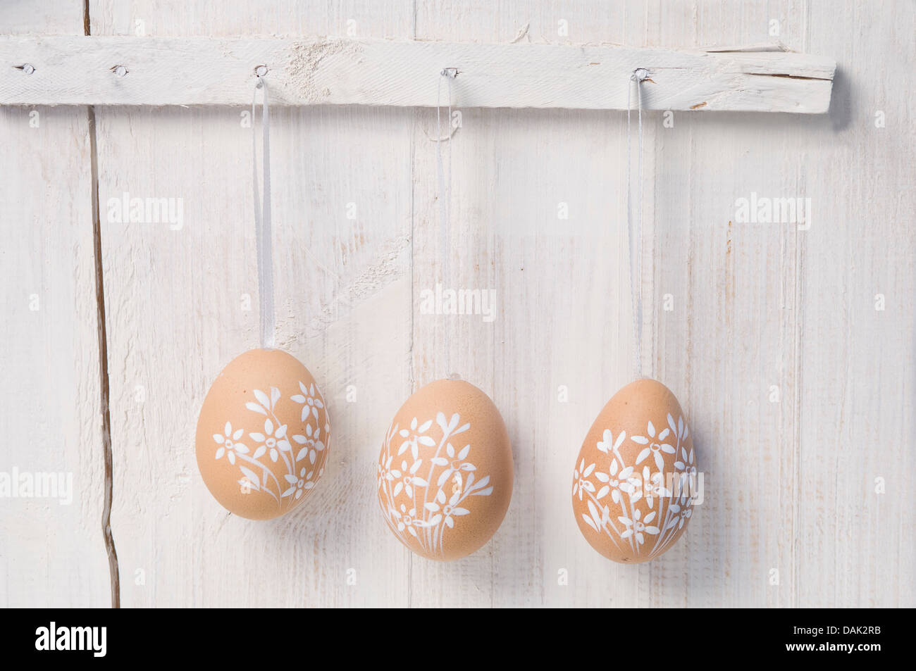 Painted easter eggs hanging on wall Stock Photo - Alamy