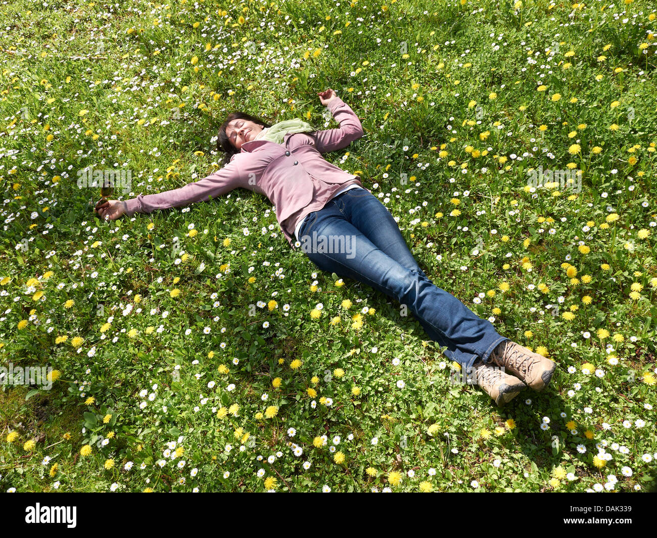 Germany, Hesse, Mature women lying on meadow Stock Photo - Alamy