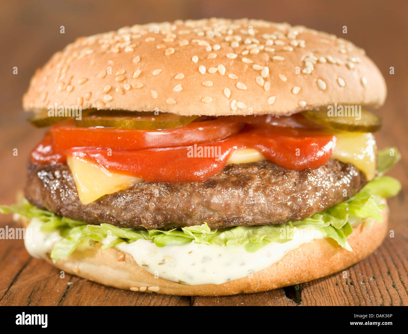 Classic burger with cheese and iceberg lettuce, close up Stock Photo ...