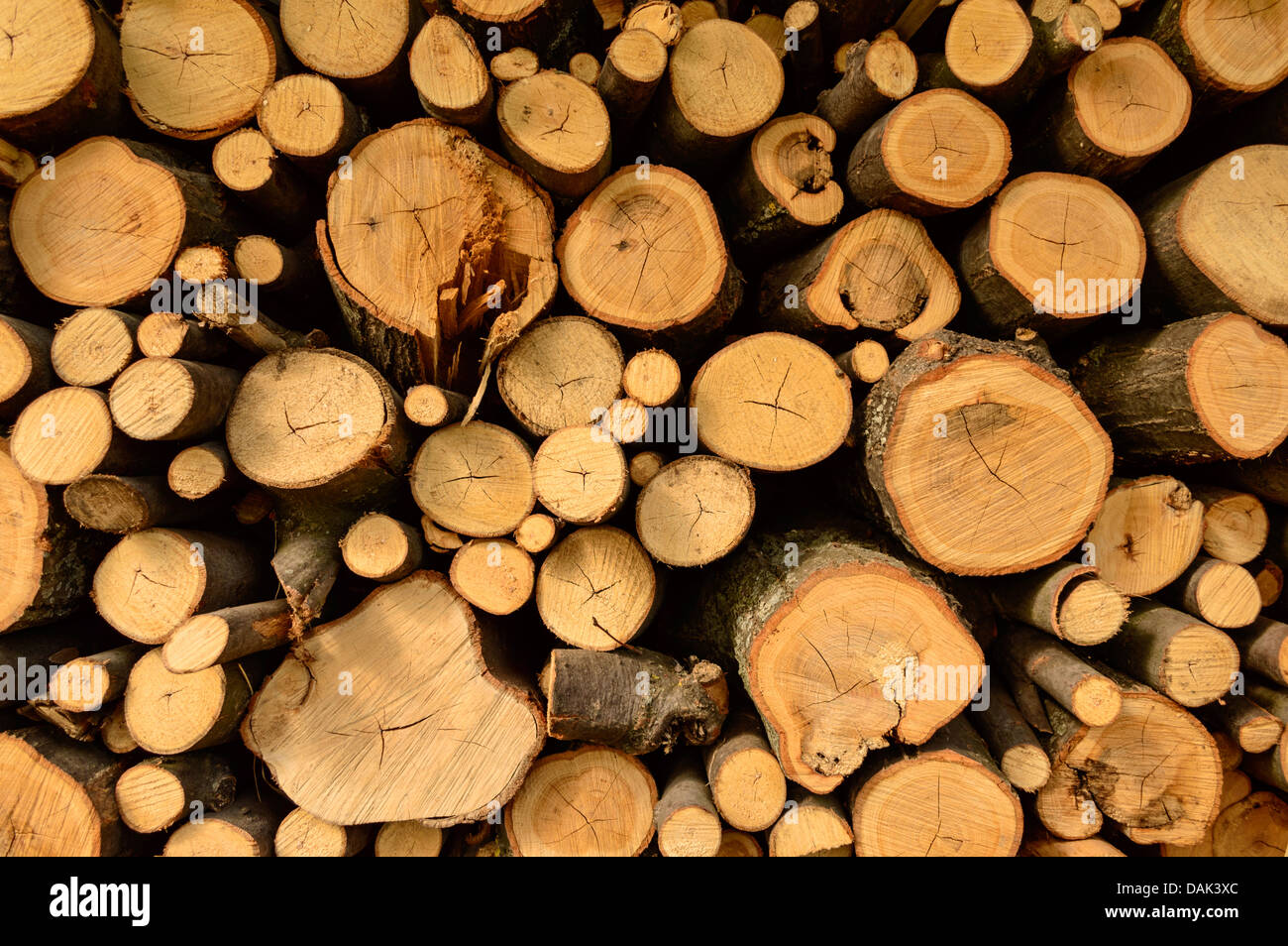 stacked logs background Stock Photo - Alamy