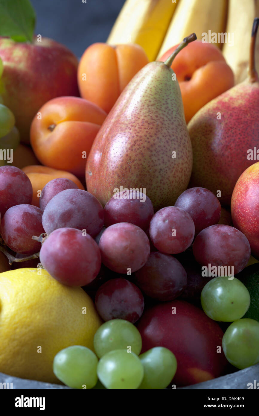 Varieties of fruits in fruit bowl, close up Stock Photo - Alamy