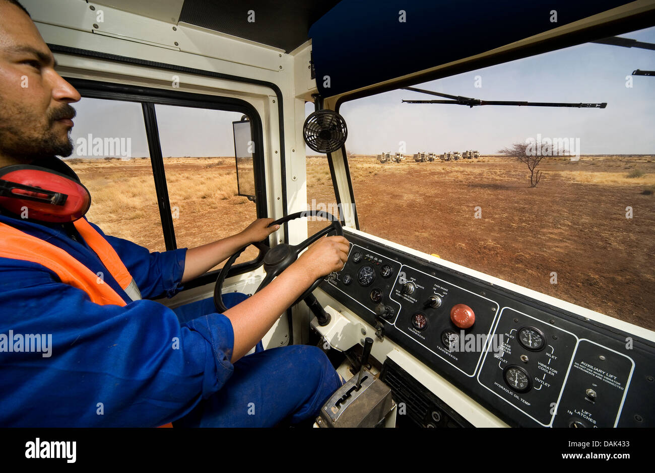 Oil exploration Mali. Inside seismic vibrator vehicle in desert and ...
